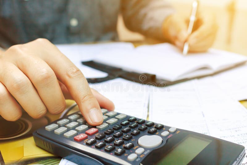 Use calculator and writing stock image. Image of manager - 33714147