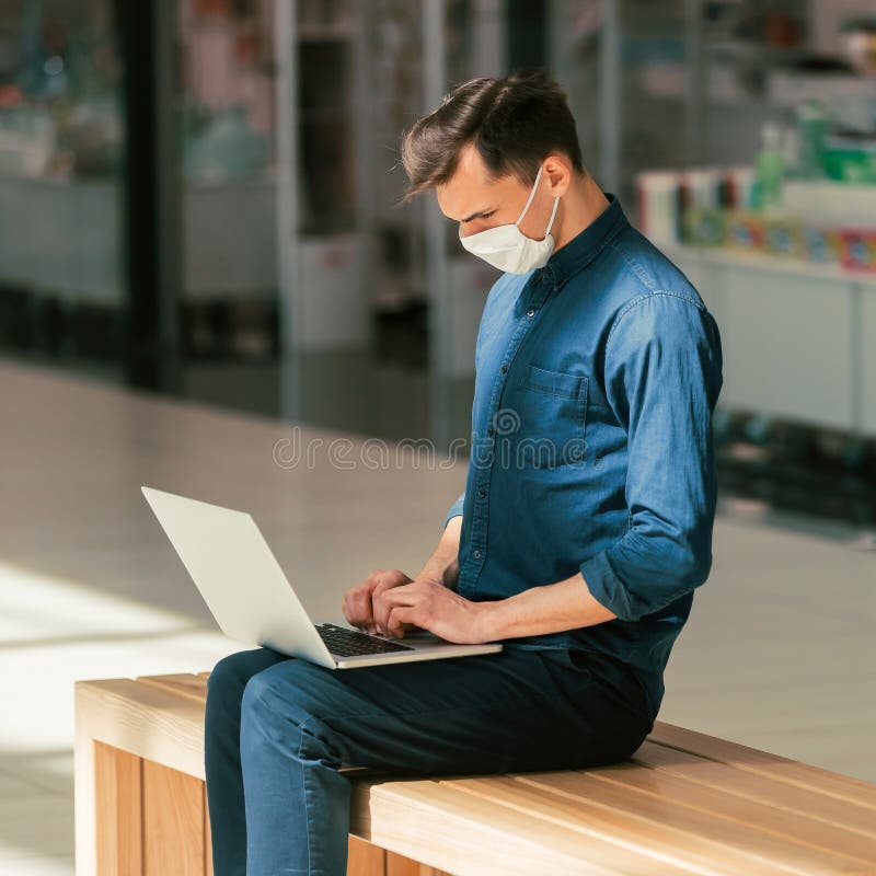 Close Up. a Man Using His Laptop while Sitting on a Bench Stock Image ...