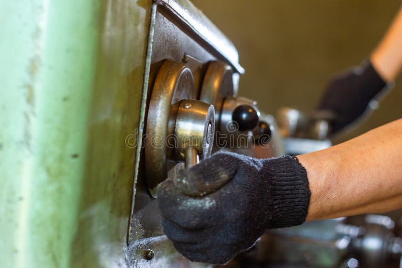 Close Up of a Man Using a Machine, Close Up of a Man Working on a ...