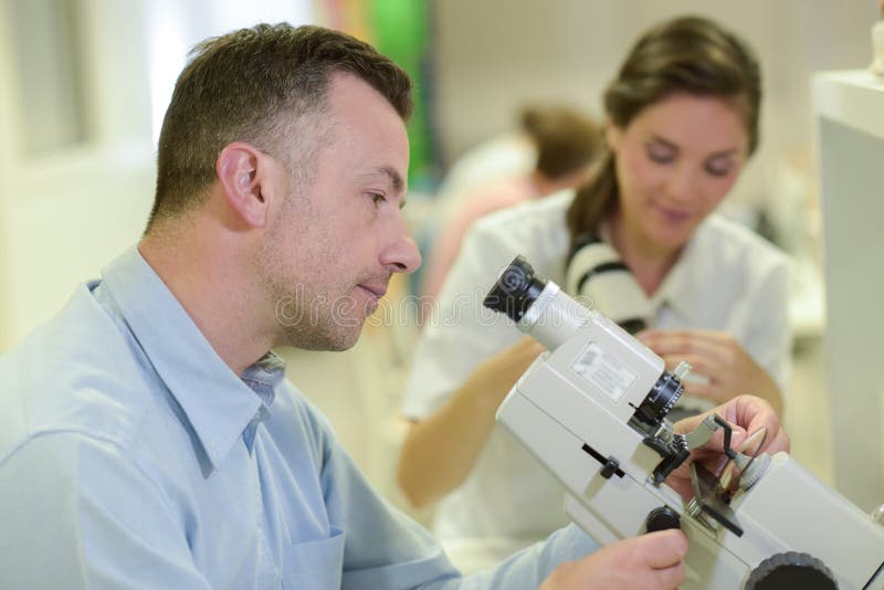 Close Up Man Using Microscope Stock Image - Image of professional ...