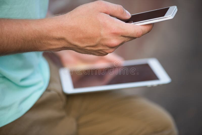 Close Up of a Man Using Mobile Smart Phone and Tablet, Focus on Hand ...