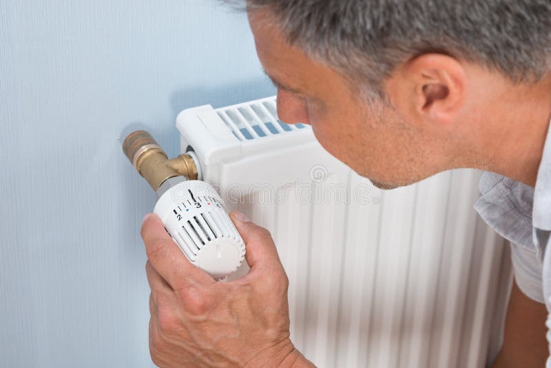 Close-up of a Man Using Radiator Stock Photo - Image of hand, adjusting ...