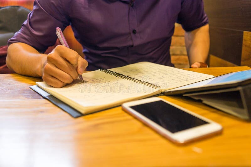 Close Up of Man Using Tablet and Writing Notes Stock Photo - Image of ...