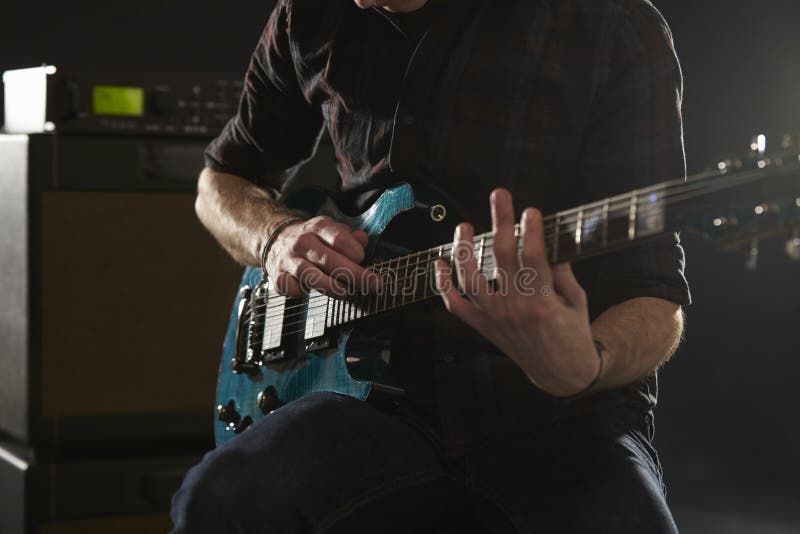 Close Up of Man Using Tapping Technique on Electric Guitar Stock Image ...