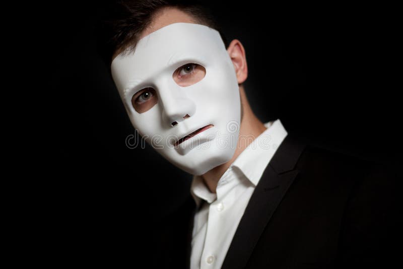 Close-up of a Man in a White Mask on a Black Background Stock Image ...