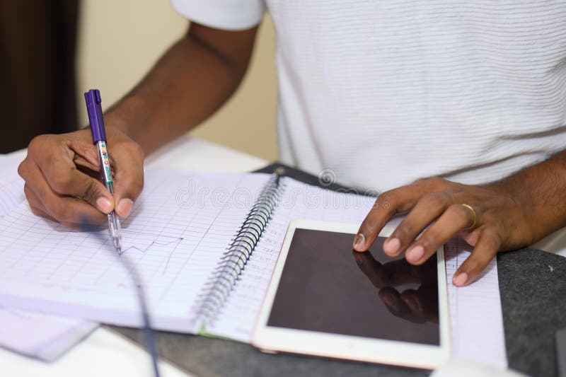 Close Up of a Man Writing in a Notebook with a Pen Stock Photo - Image ...