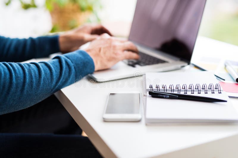 Close Up of Man Writing Notes in Planner, Working at Desk from Home ...