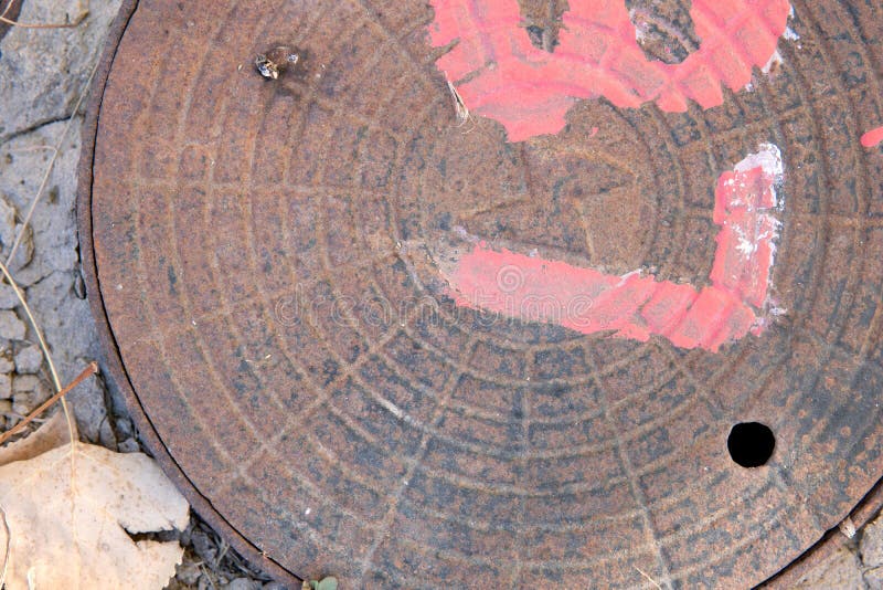 Close-up of a Manhole Cover on the Ground in the City Stock Image ...