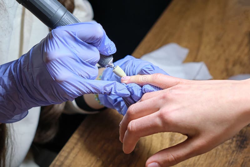 Close-up Manicure Master Works in Nail Salon Stock Image - Image of ...