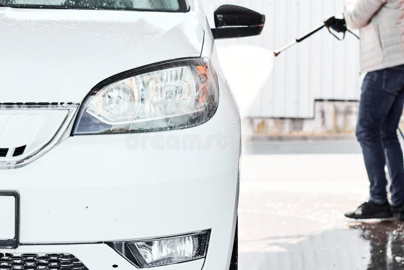 Close Up Mans Hand Washing a White Car Using High Pressure Water. Car ...