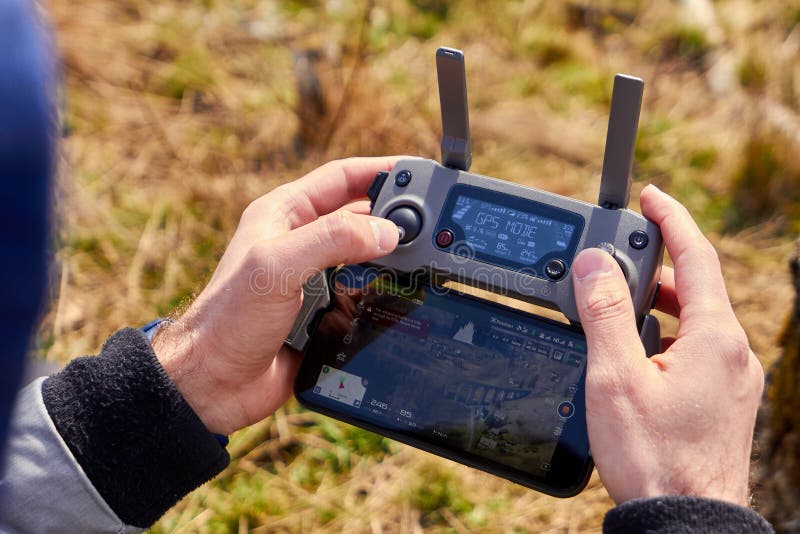 Hands with Remote Controller of Drone Outside. Man Using RC for Flying ...
