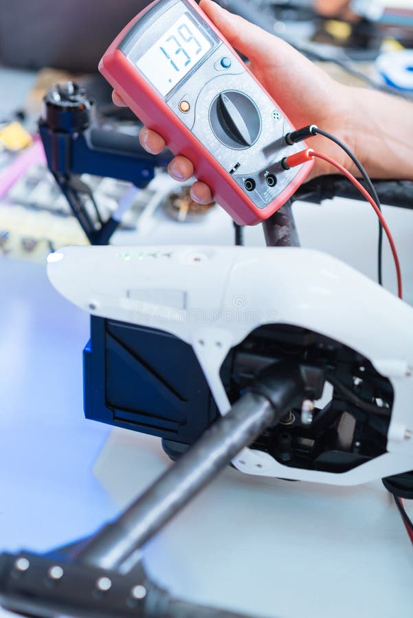 Close Up of Mans Hands Using Electronic Tester and Drone Stock Image ...