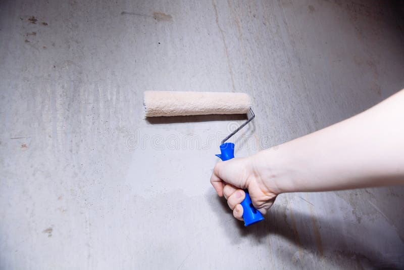 Close-up of Mans Hands Using Paint Roller while Working Stock Photo ...