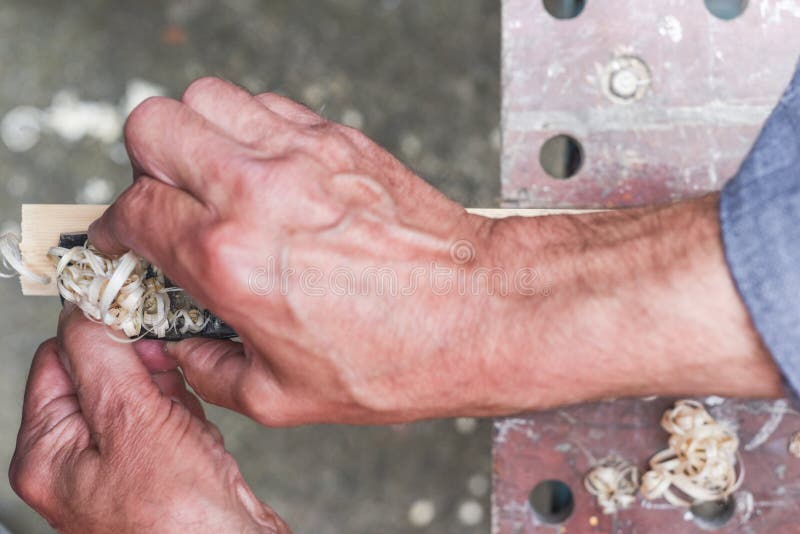 Close Up of Mans Hands Working with a Plane on Wooden Plank Stock Image - Image of trade, hand ...