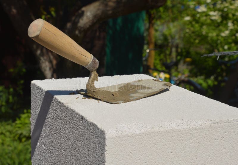 A Close Up on a Masonry Trowel, a Working Tool of a Bricklayer on an ...