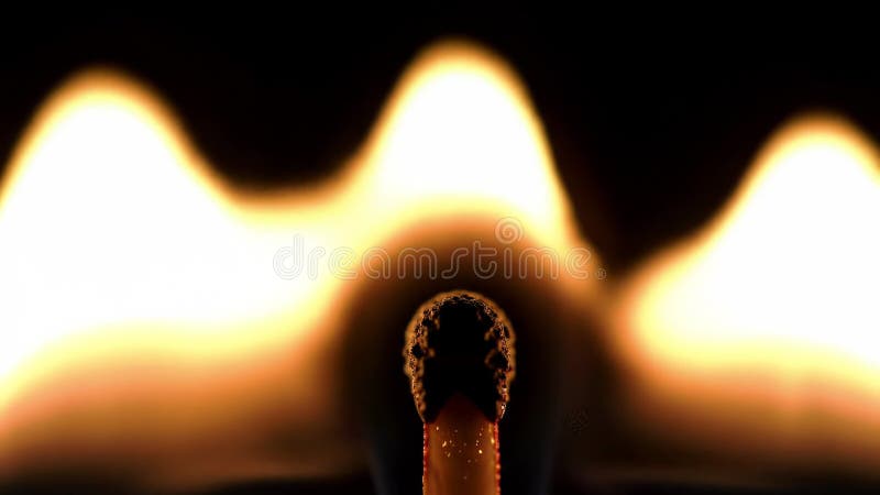 Close-up of Matchstick Igniting with Bright Flame Against Dark ...
