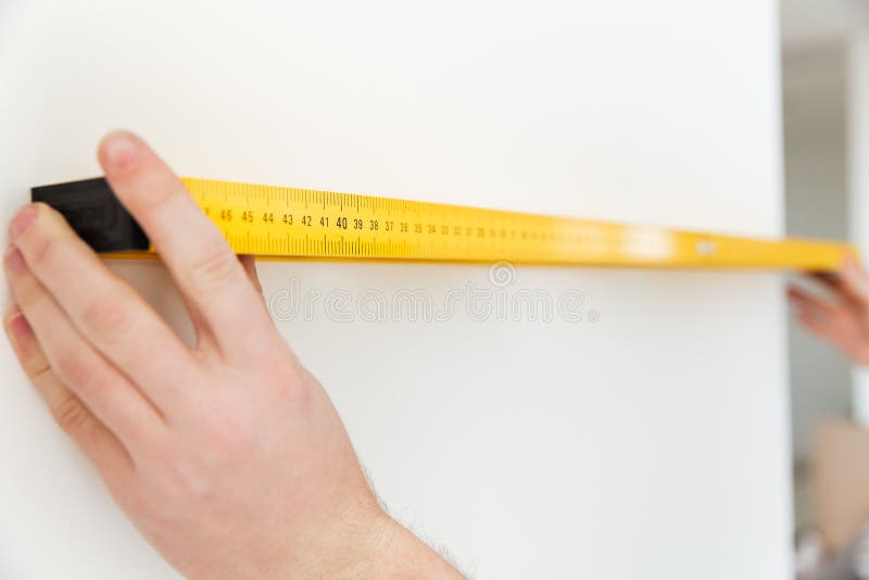 Close Up of Measuring Tape in Man`s Hand Stock Image - Image of ...