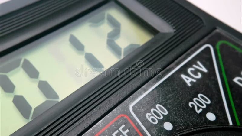 Close-up of Measuring Voltage with a Digital Multimeter. Close-up of ...