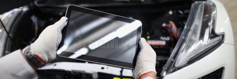 Mechanic Use Tablet Device with Black Screen in Front of Car. Stock ...