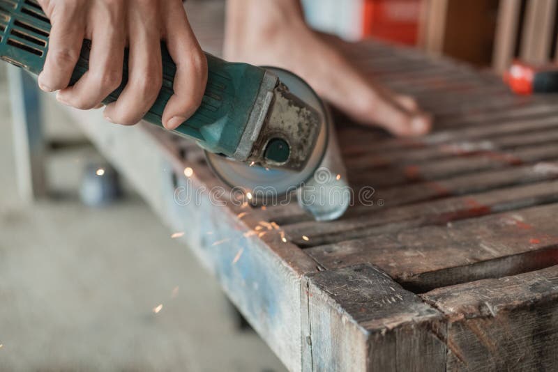 Close Up of Mechanical Hands Using Grinding Machines To Smooth the ...