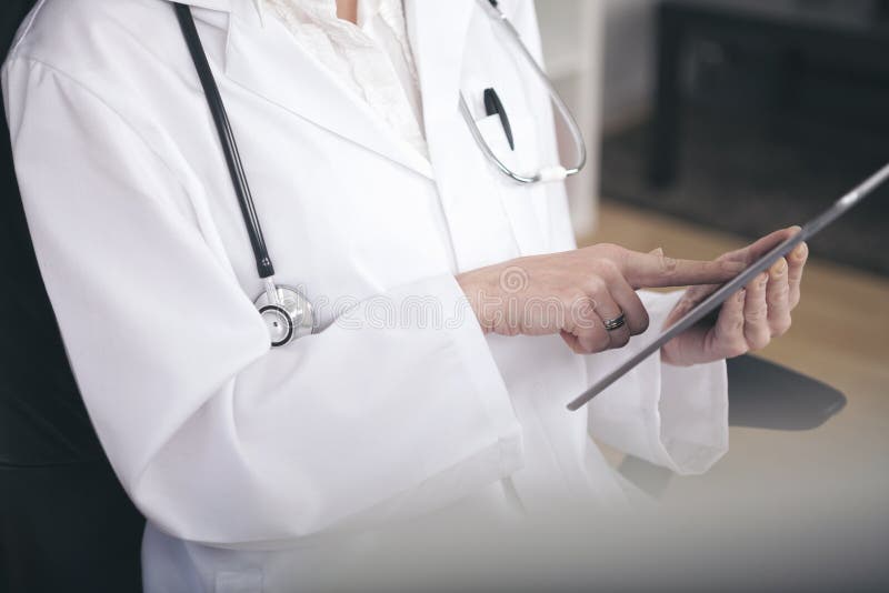 Medical Doctor Using Smart Phone for Work in Hospital Stock Image ...