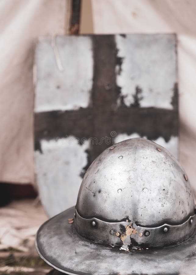 Close-up of a Medieval Helmet and Shield with a Cross, Showcasing ...