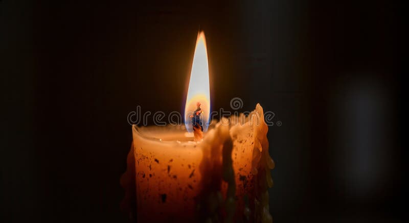 Close-up of Melting Candle with Flickering Flame in Dark Background ...