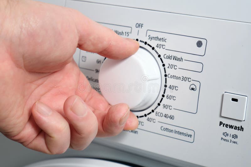 Close-up a Men S Hand Sets the Automatic Washing Program Switch on the ...