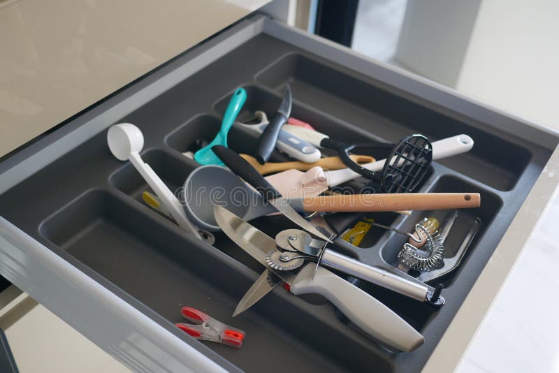 Close Up of Messy Kitchen Utensil Drawer. Stock Photo - Image of full ...