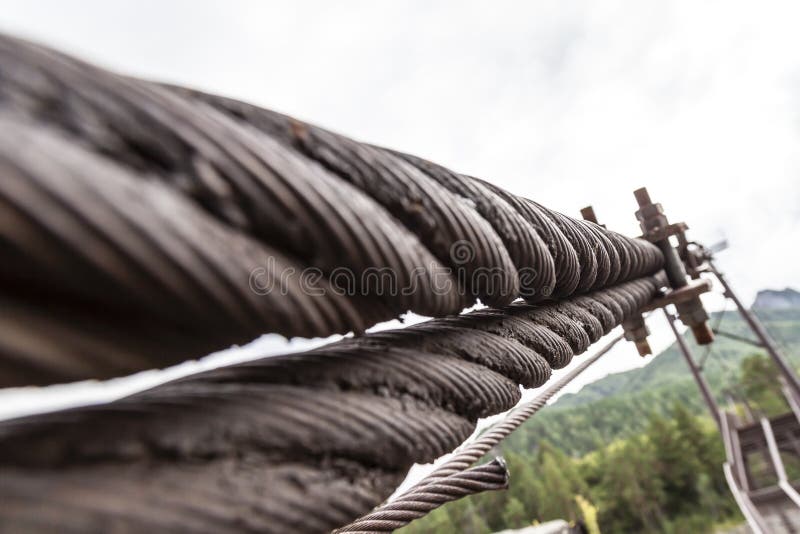 Close-up on a Metal Binding Cable Going in Perspective To the Bridge ...