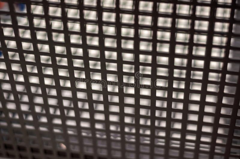 Close-up of a Metal Mesh Reveals a Precise Grid Pattern with Sharp ...