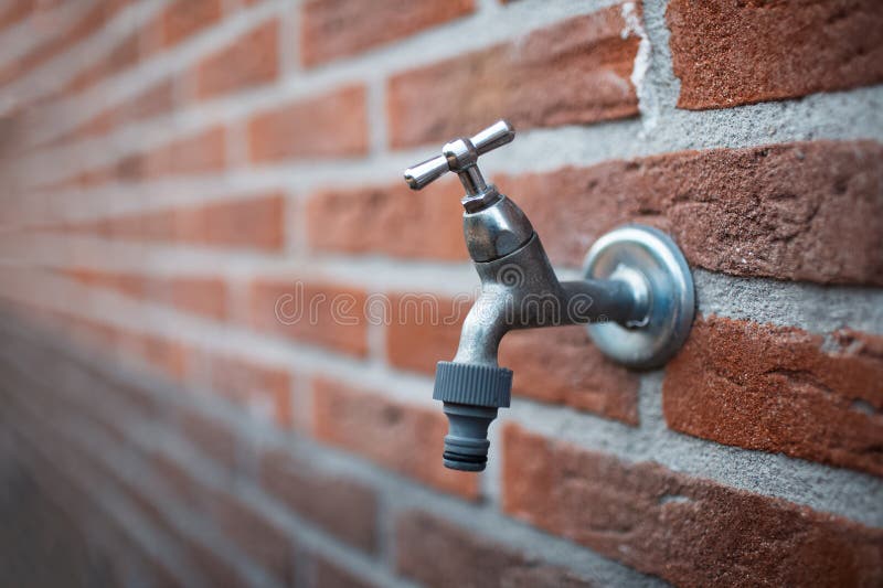 Close-up of Metal Outdoor Tap on Bricks Wall Stock Photo - Image of ...