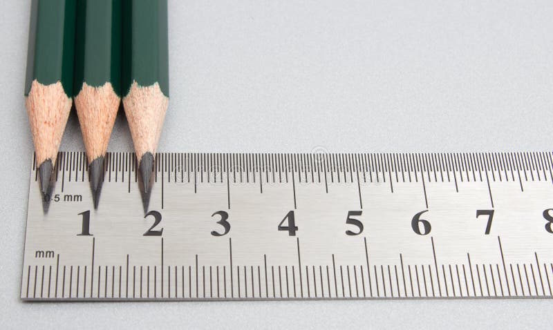 Metal Ruler with Protractor and Pencil on Wood Angled Stock Photo ...