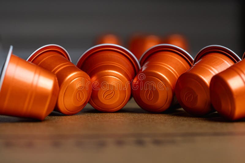 Close-Up of Metallic Coffee Capsule Pods on a Black Background Stock ...