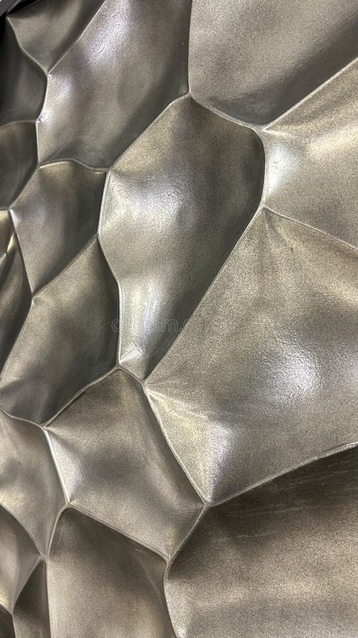 Close-up of a Metallic, Geometric Textured Surface Featuring Undulating ...