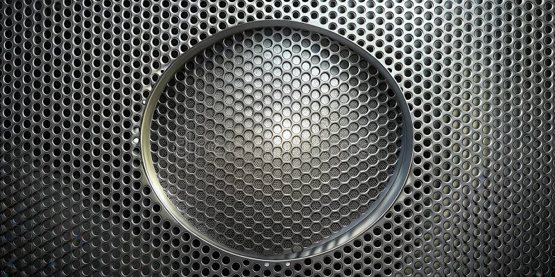 Close-up of a Metallic Speaker Grille with a Circular Pattern ...