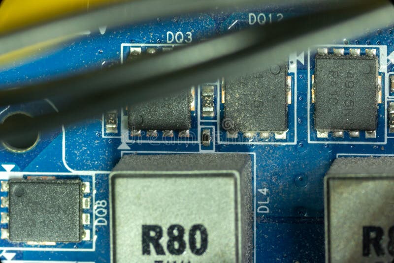 Close-up of Microcircuits and Transistors on a Motherboard in a ...