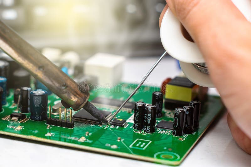 Close Up of Microelectronics Engineering. Soldering Lead Repairing ... Close Up of Microelectronics Engineering. Soldering Lead Repairing ...
