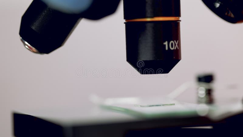 Close-up of Microscope Lens with Sample in Laboratory Stock Footage ...