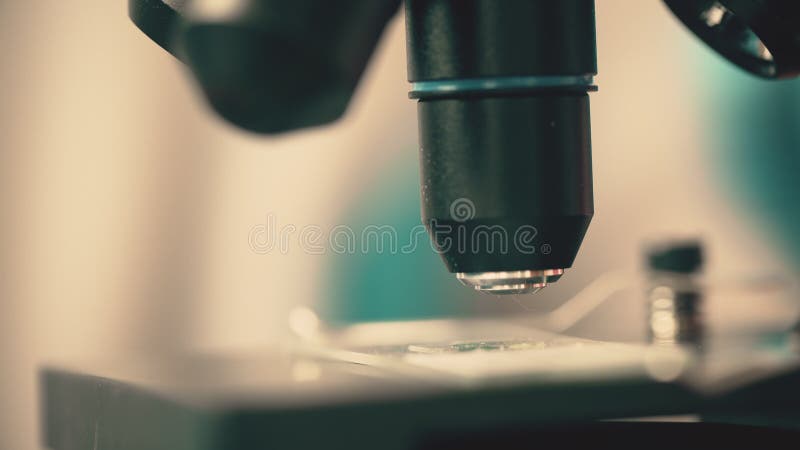 Close-up of Microscope Lens with Sample in Laboratory Stock Footage ...