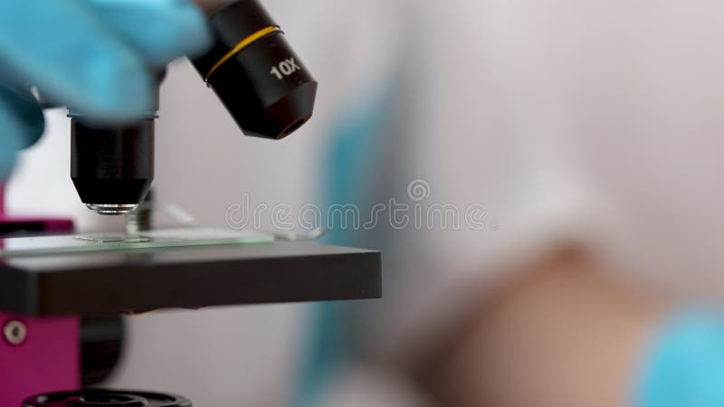 Close-up of Microscope Lens with Sample in Laboratory Stock Footage ...