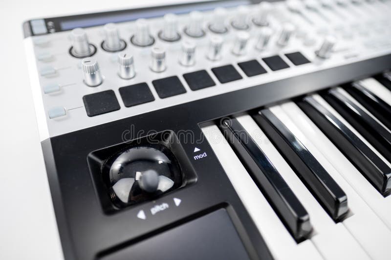 Close-Up of a MIDI Keyboard Controller with Knobs, Keys, and Modulation ...