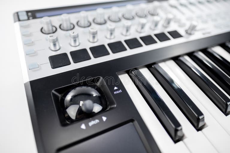 Close-Up of a MIDI Keyboard Controller with Knobs, Keys, and Modulation ...