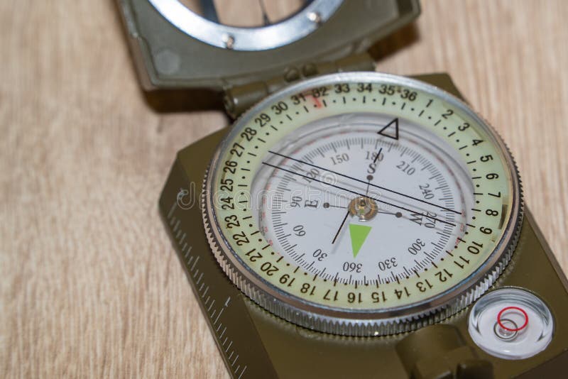Close-up of a Military Compass on a Wooden Surface. Determining the ...