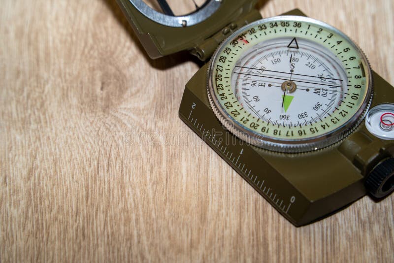Close-up of a Military Compass on a Wooden Surface. Determining the ...