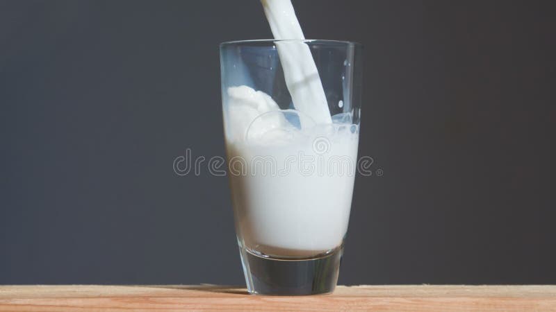Close-up of Milk Being Poured into a Cup of Coffee Stock Video - Video ...