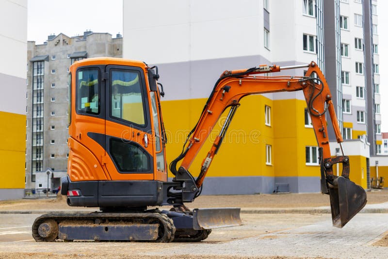Close-up Mini Excavator during the Construction of a Modern Residential ...