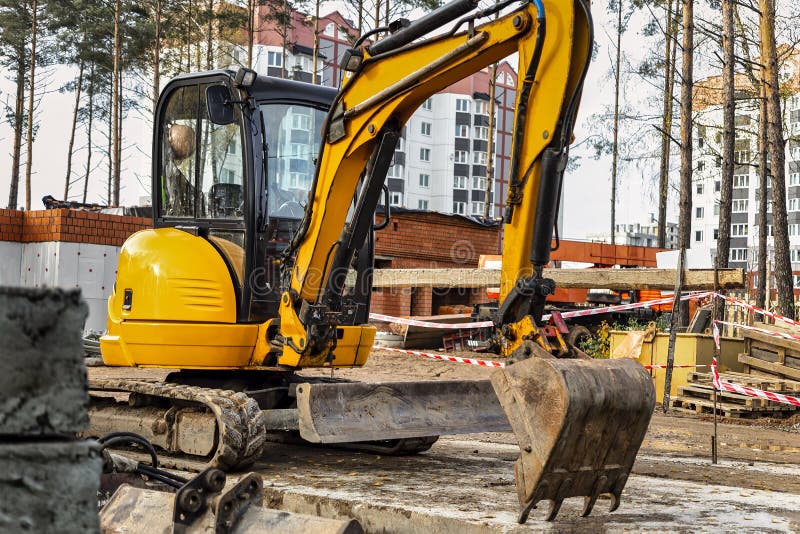 Close-up Mini Excavator during the Construction of a Modern Residential ...