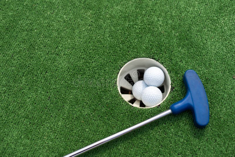 Close-up of Miniature Golf Hole with Bat and Ball Stock Image - Image ...