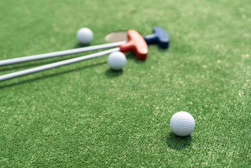 Close-up of Miniature Golf Hole with Bat and Ball Stock Image - Image ...